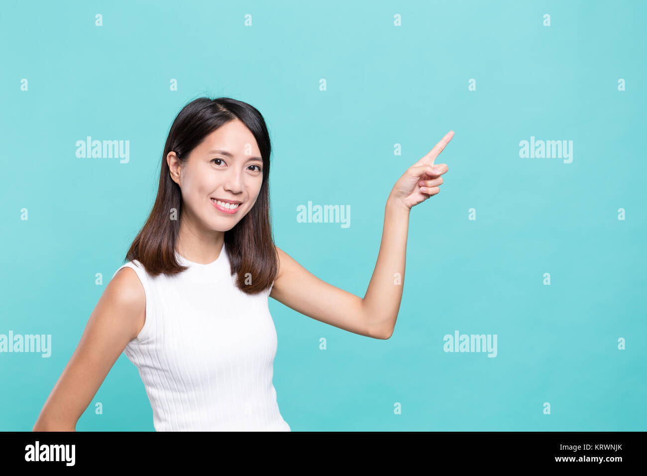 Woman showing finger pointing up Stock Photo - Alamy