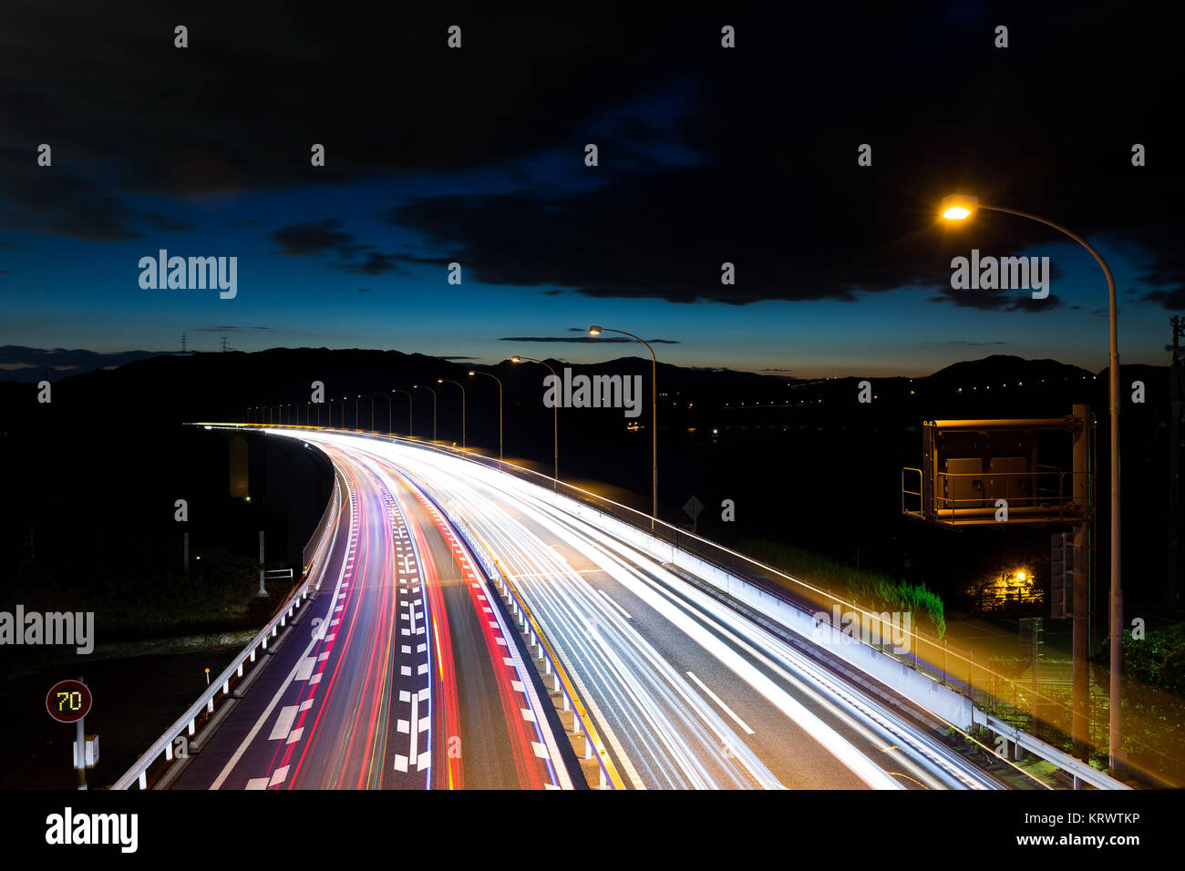 Speed Traffic on highway at night Stock Photo - Alamy