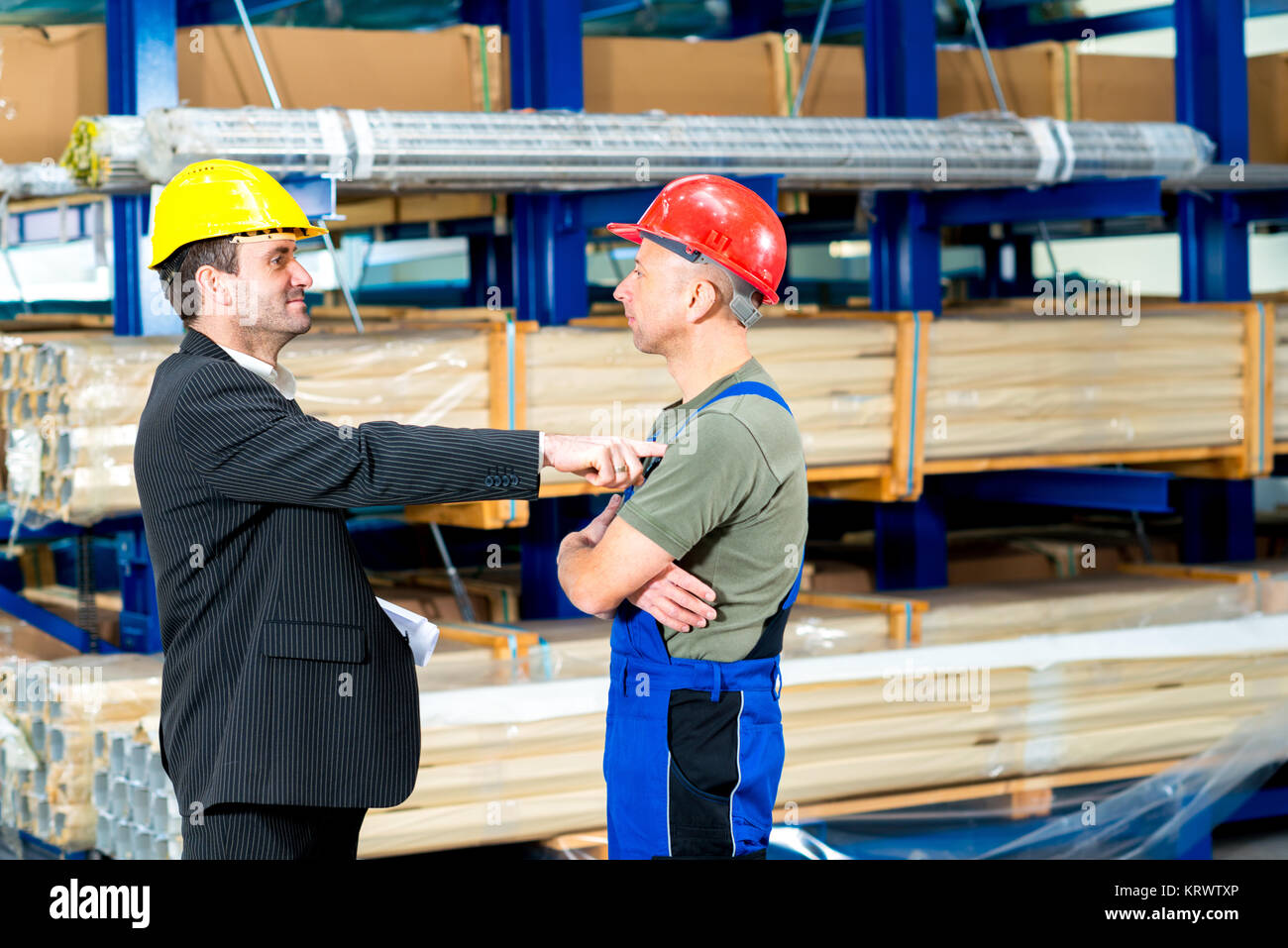 in the factory- boss and worker in conversation Stock Photo - Alamy