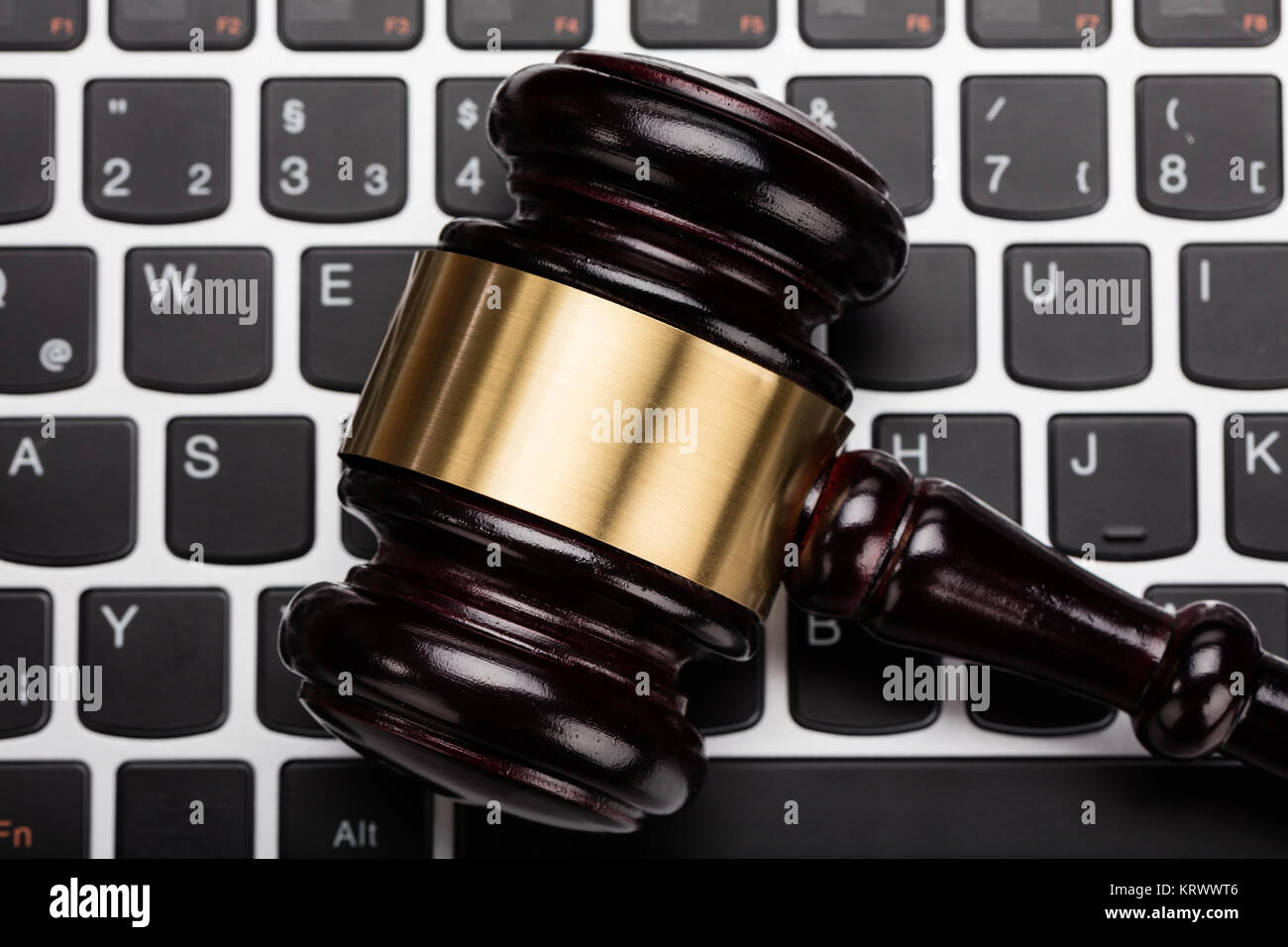 Judge Gavel On Laptop Keyboard Stock Photo - Alamy