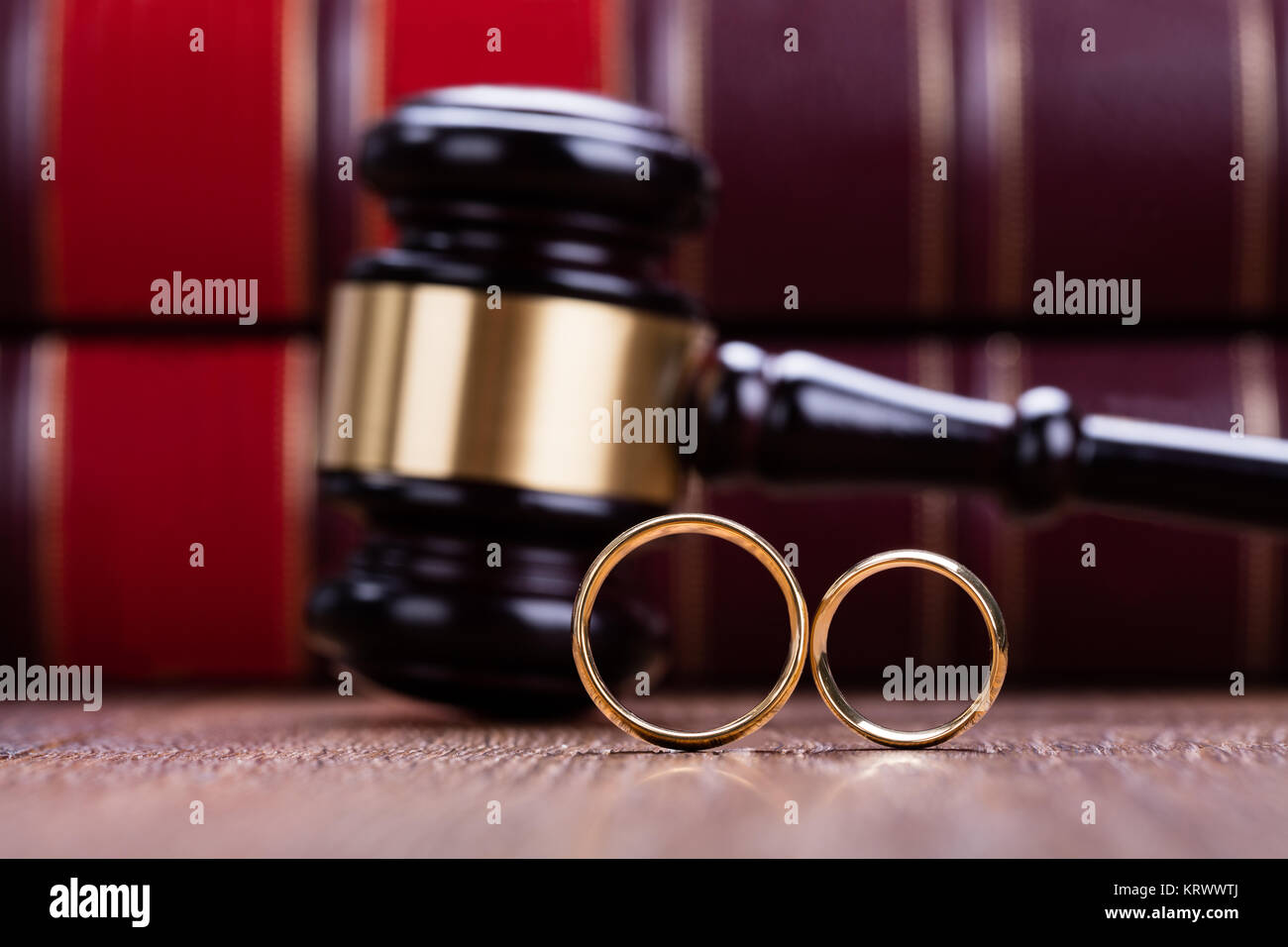Wedding Rings Are Placed On Gavel Stock Photo - Alamy