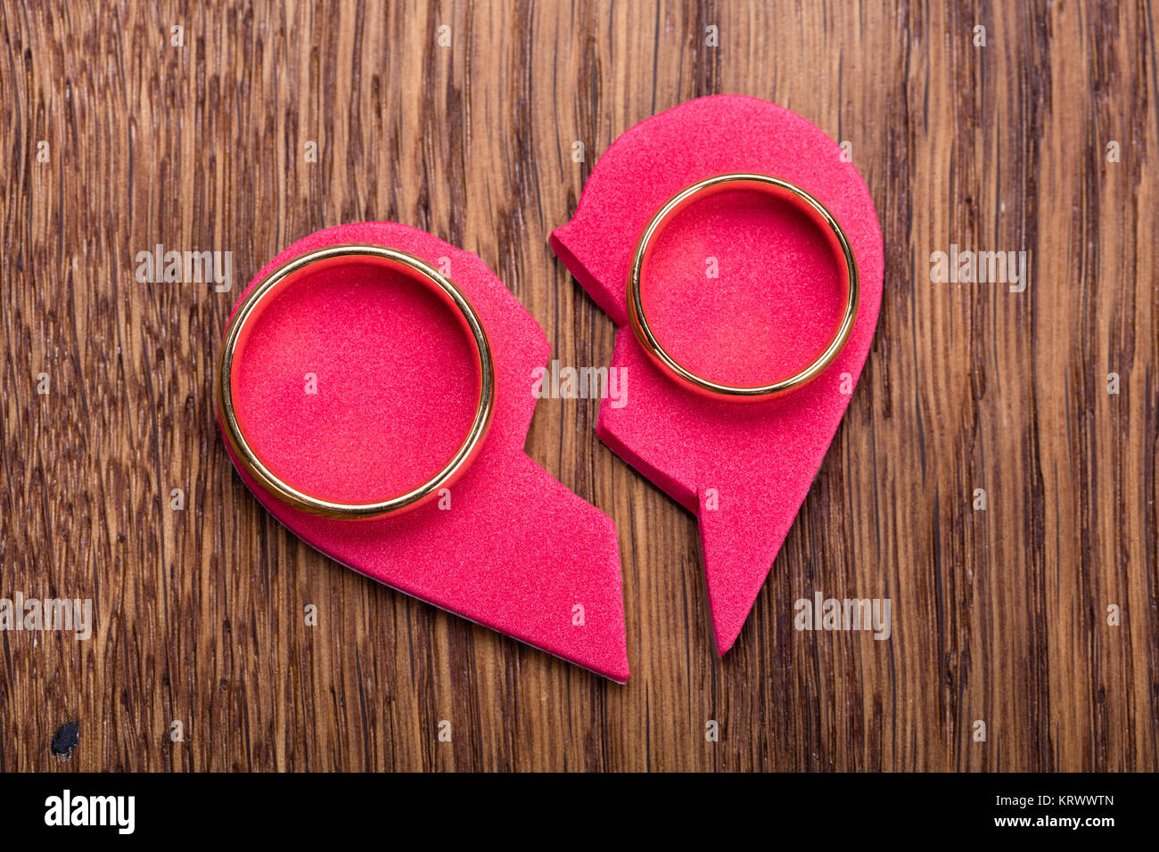 Golden Ring On Red Broken Heart Stock Photo - Alamy