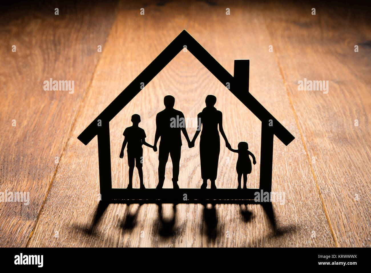 Papercut Of House With Family In It Stock Photo - Alamy