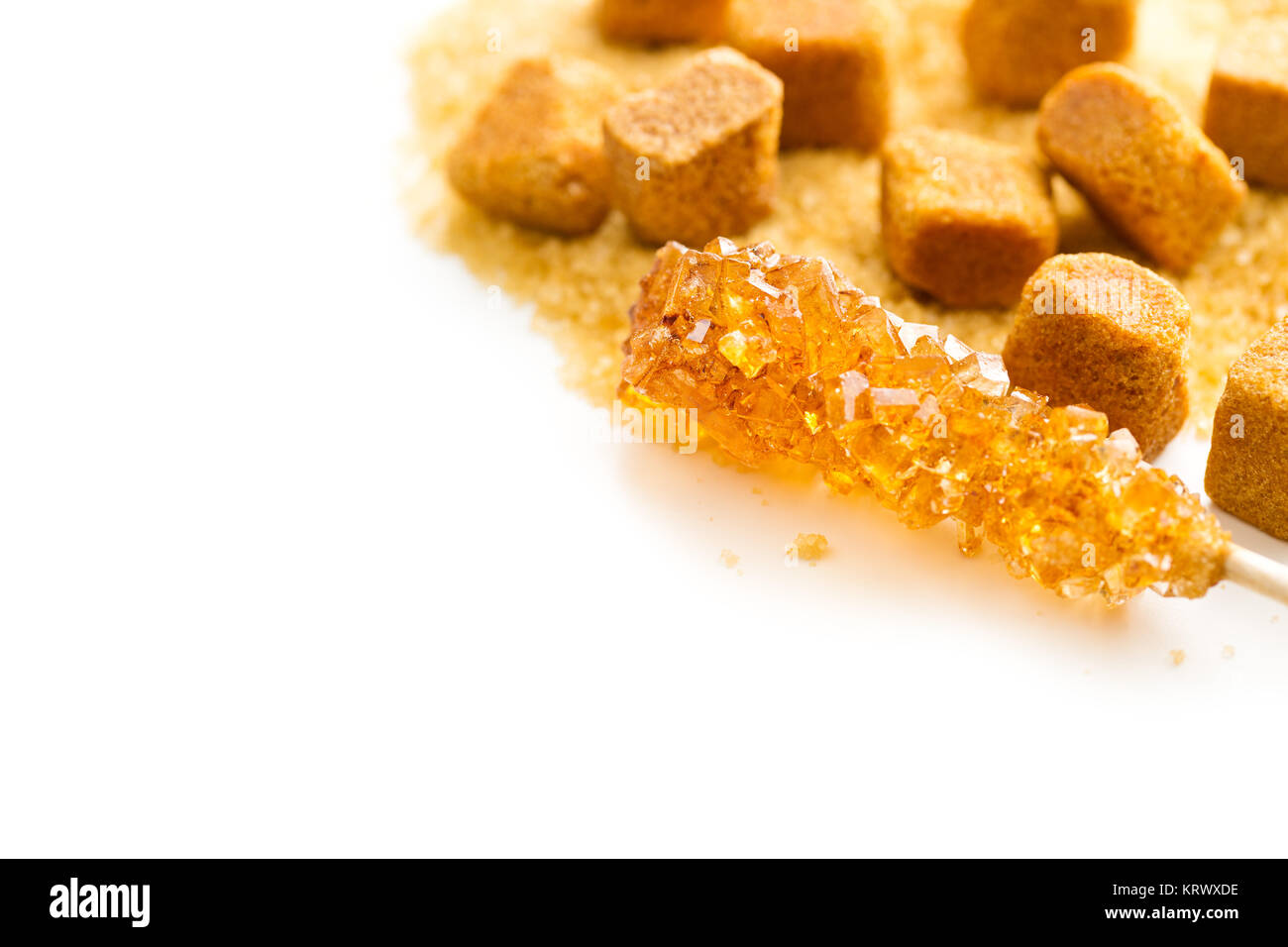 Brown amber sugar crystal on wooden stick Stock Photo - Alamy