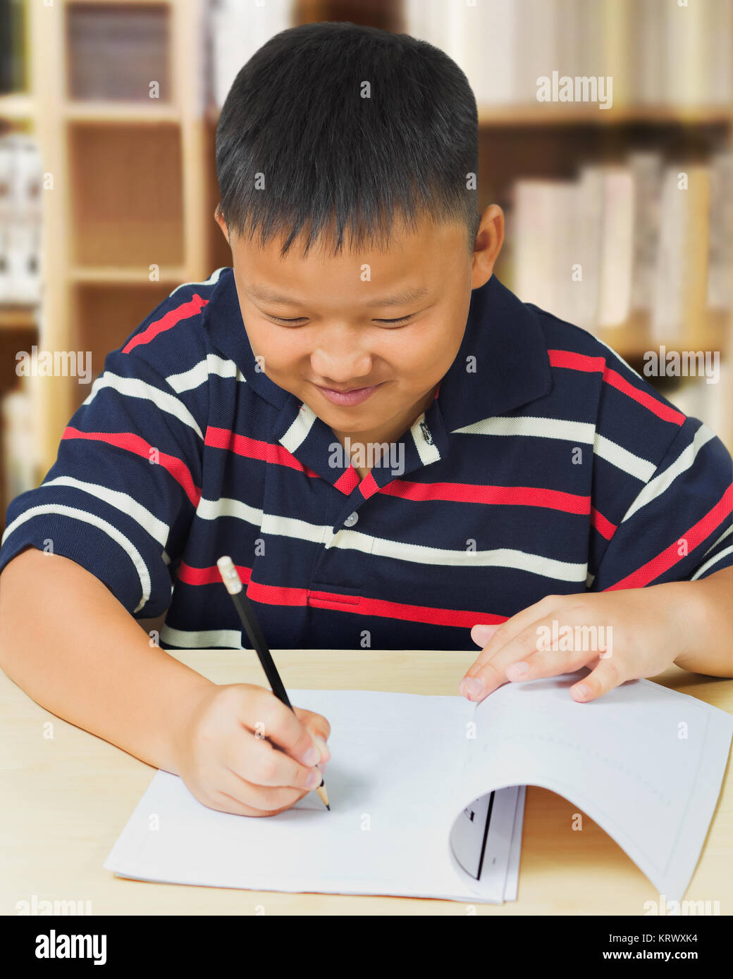 Young asian boy happy with his homework Stock Photo - Alamy