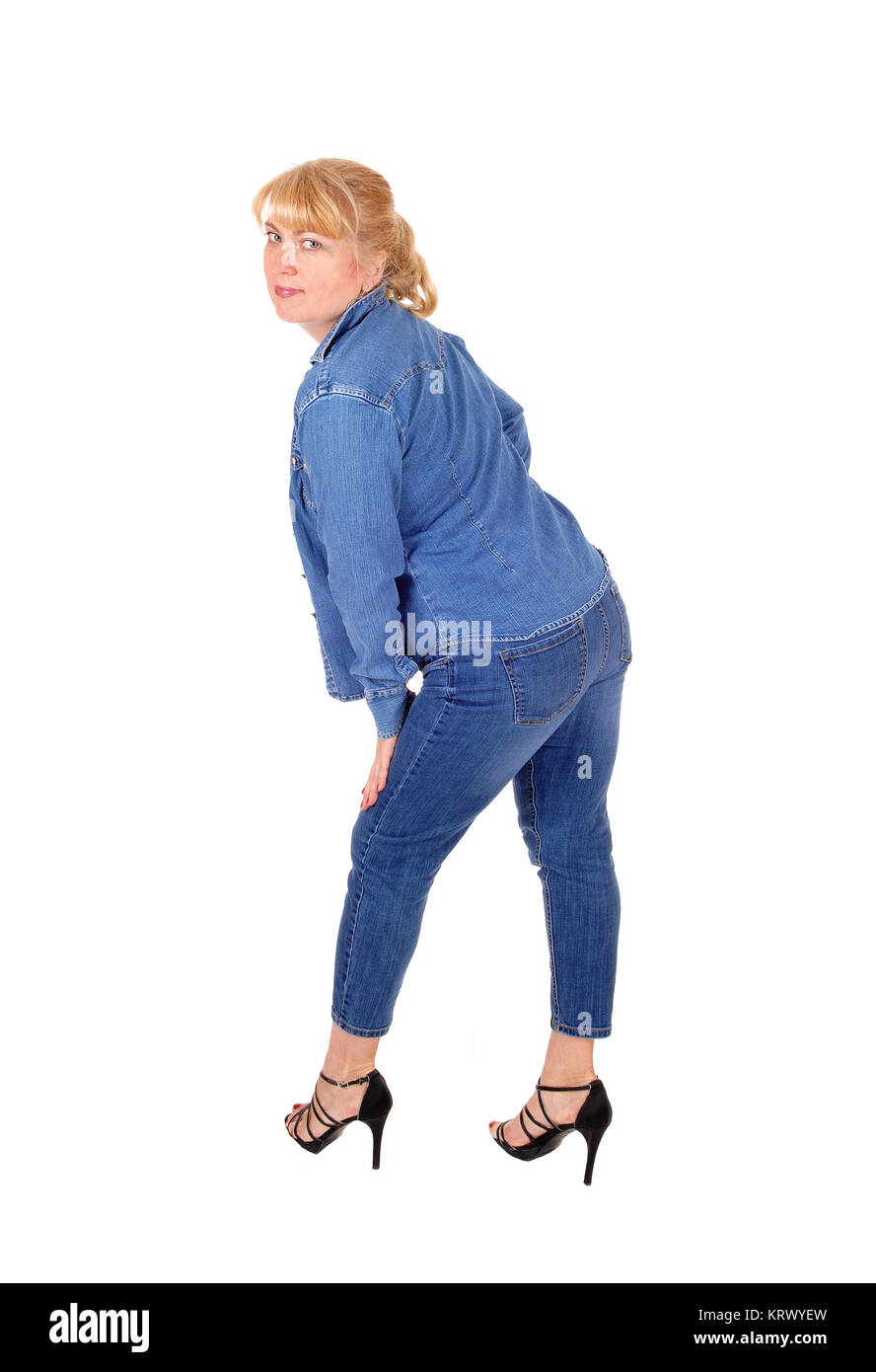 Woman in jeans bending forwards Stock Photo - Alamy