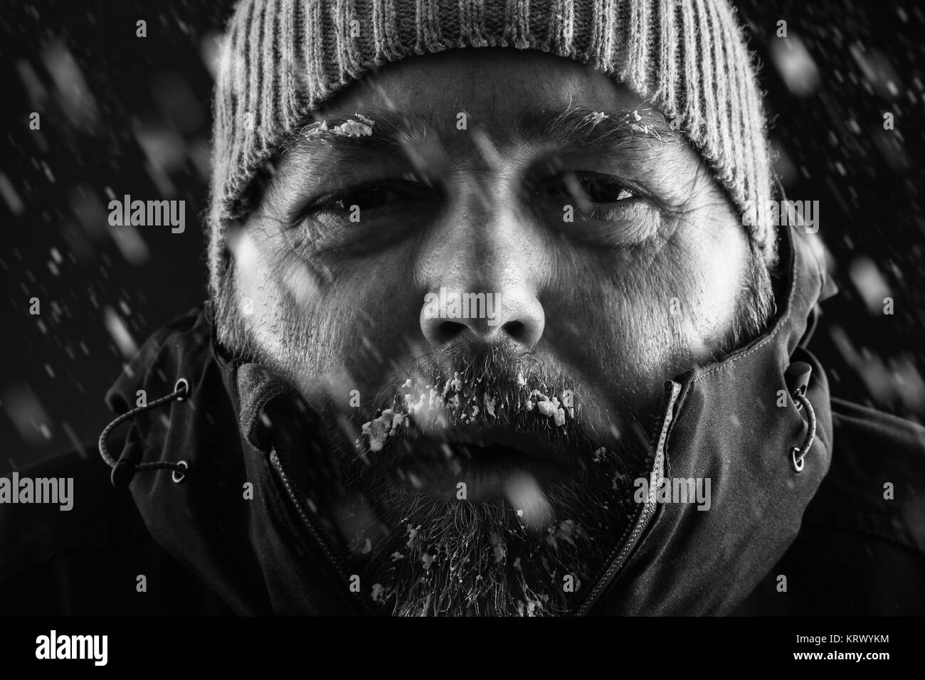 Man freezing in snow storm close up BW Stock Photo - Alamy