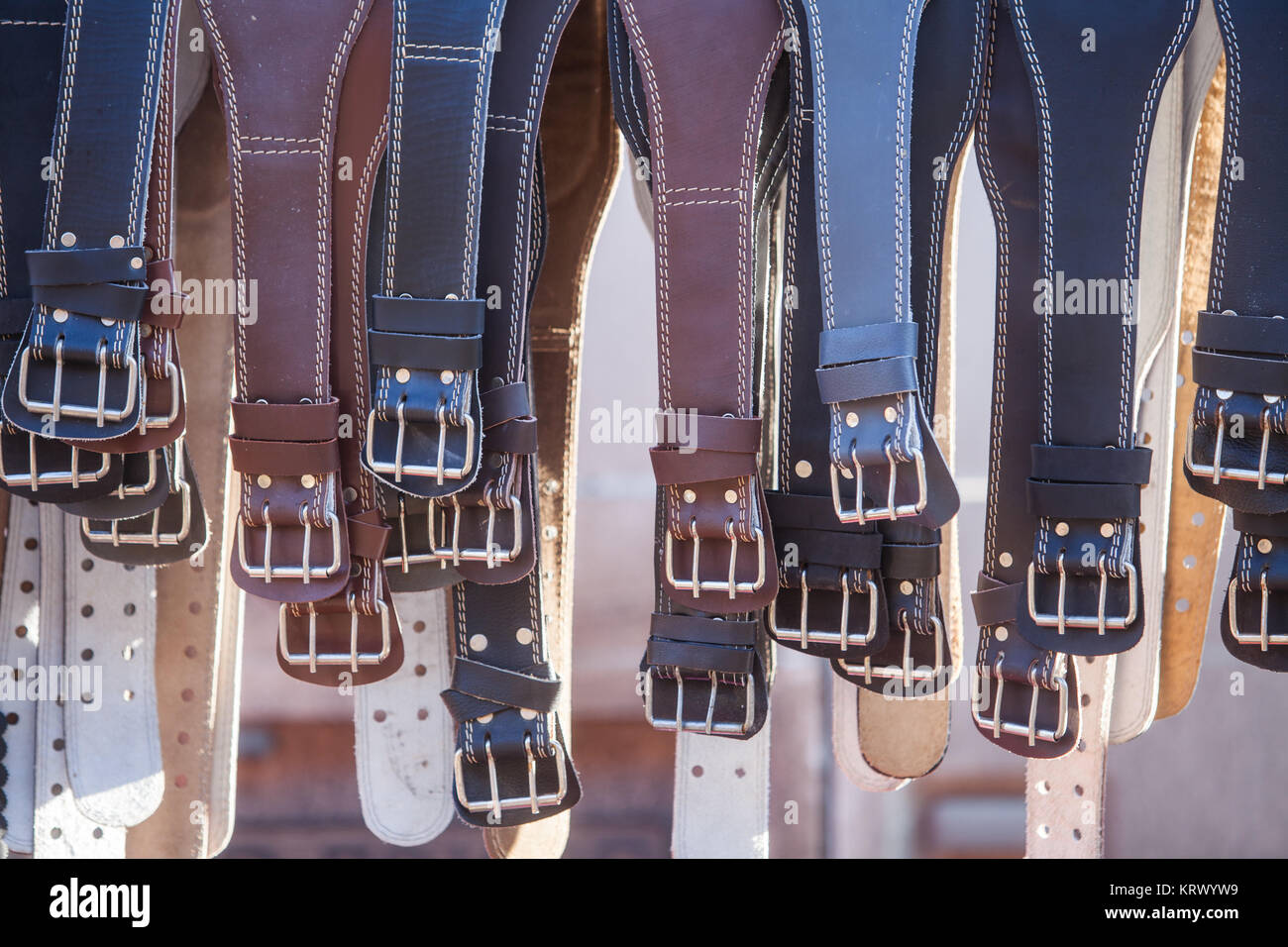 Many leather belts Stock Photo - Alamy