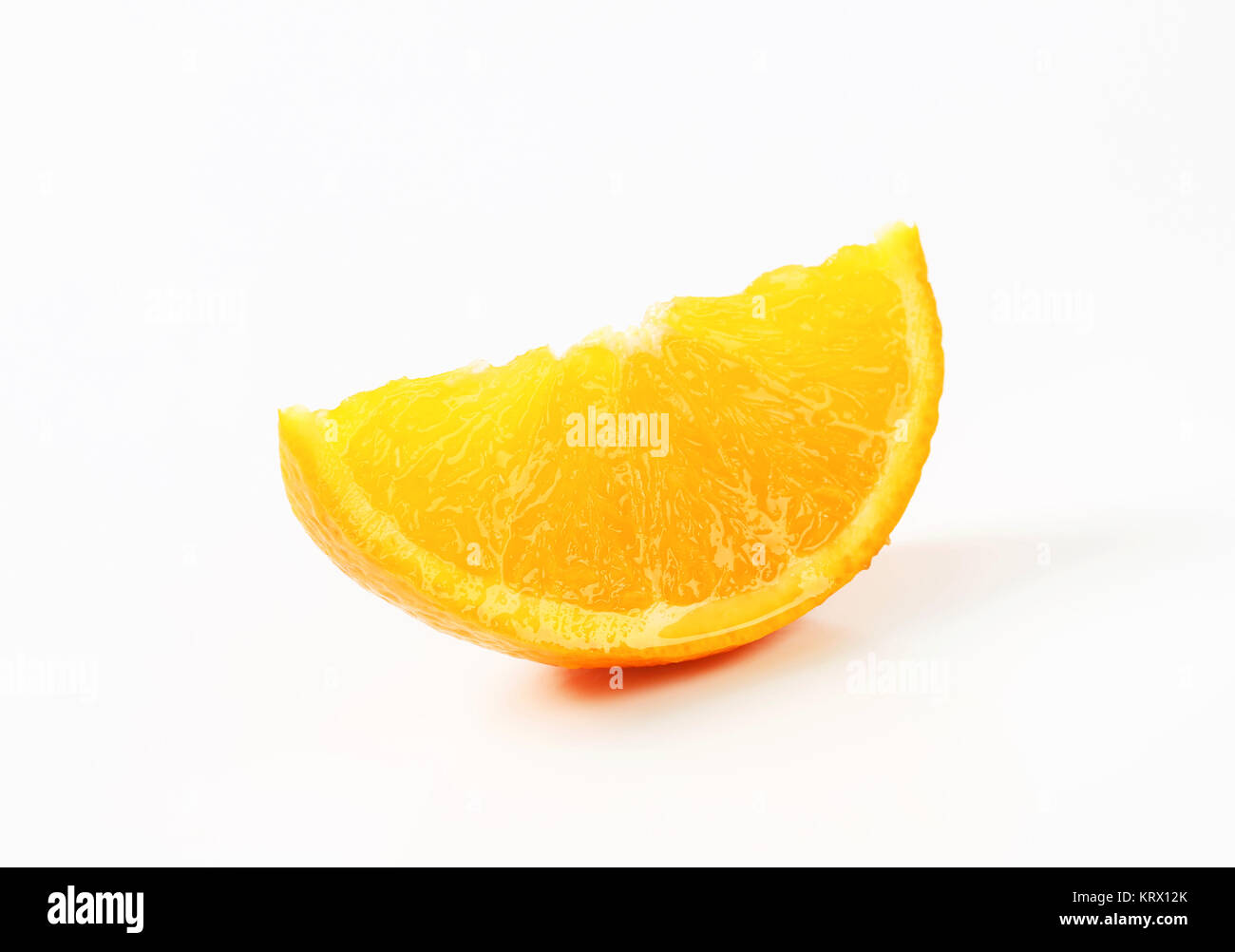 Single orange wedge Stock Photo - Alamy