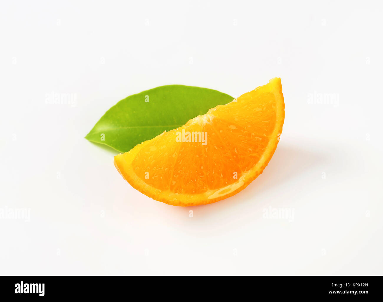 Single orange wedge Stock Photo - Alamy