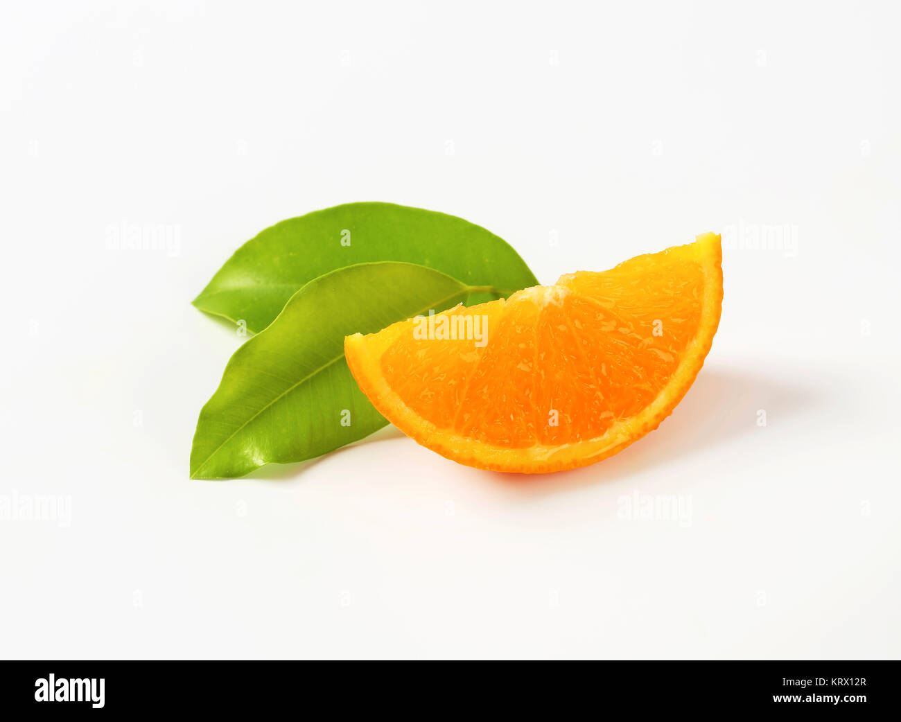 Single orange wedge Stock Photo - Alamy