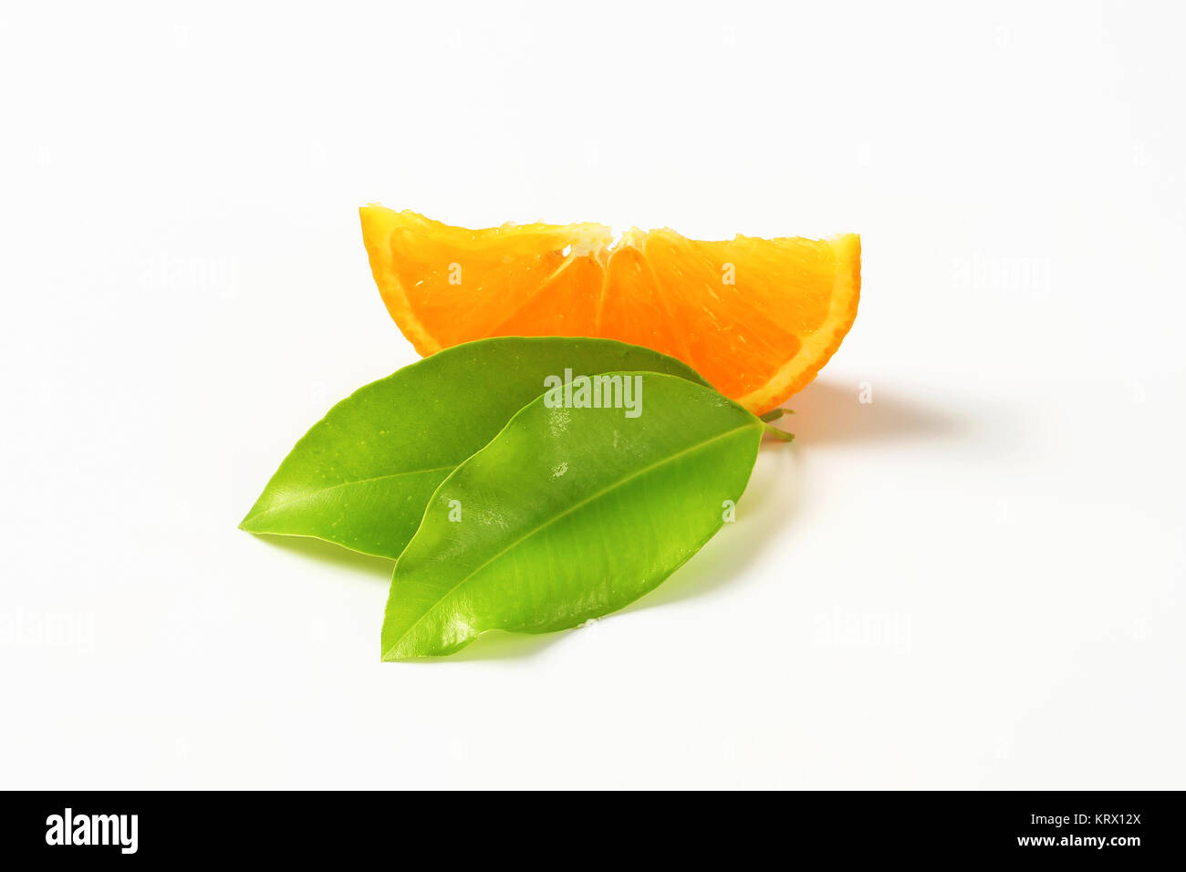 Single orange wedge Stock Photo - Alamy