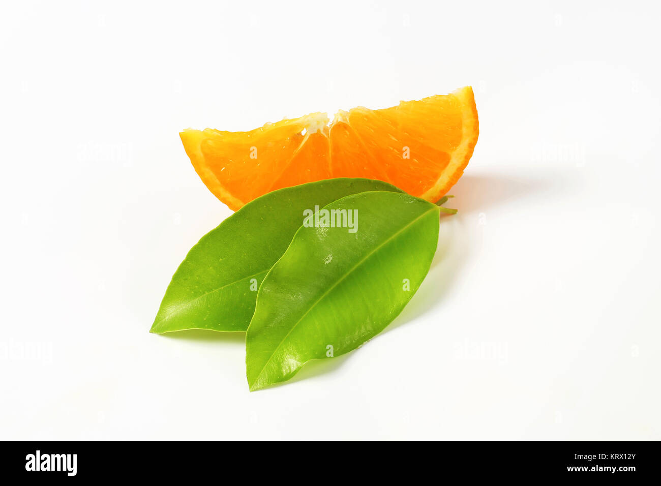 Single orange wedge Stock Photo - Alamy
