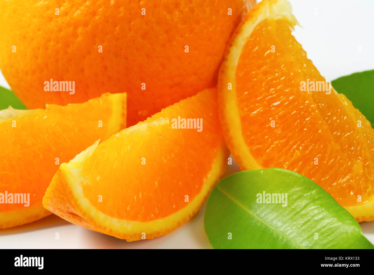 Fresh orange wedges Stock Photo - Alamy