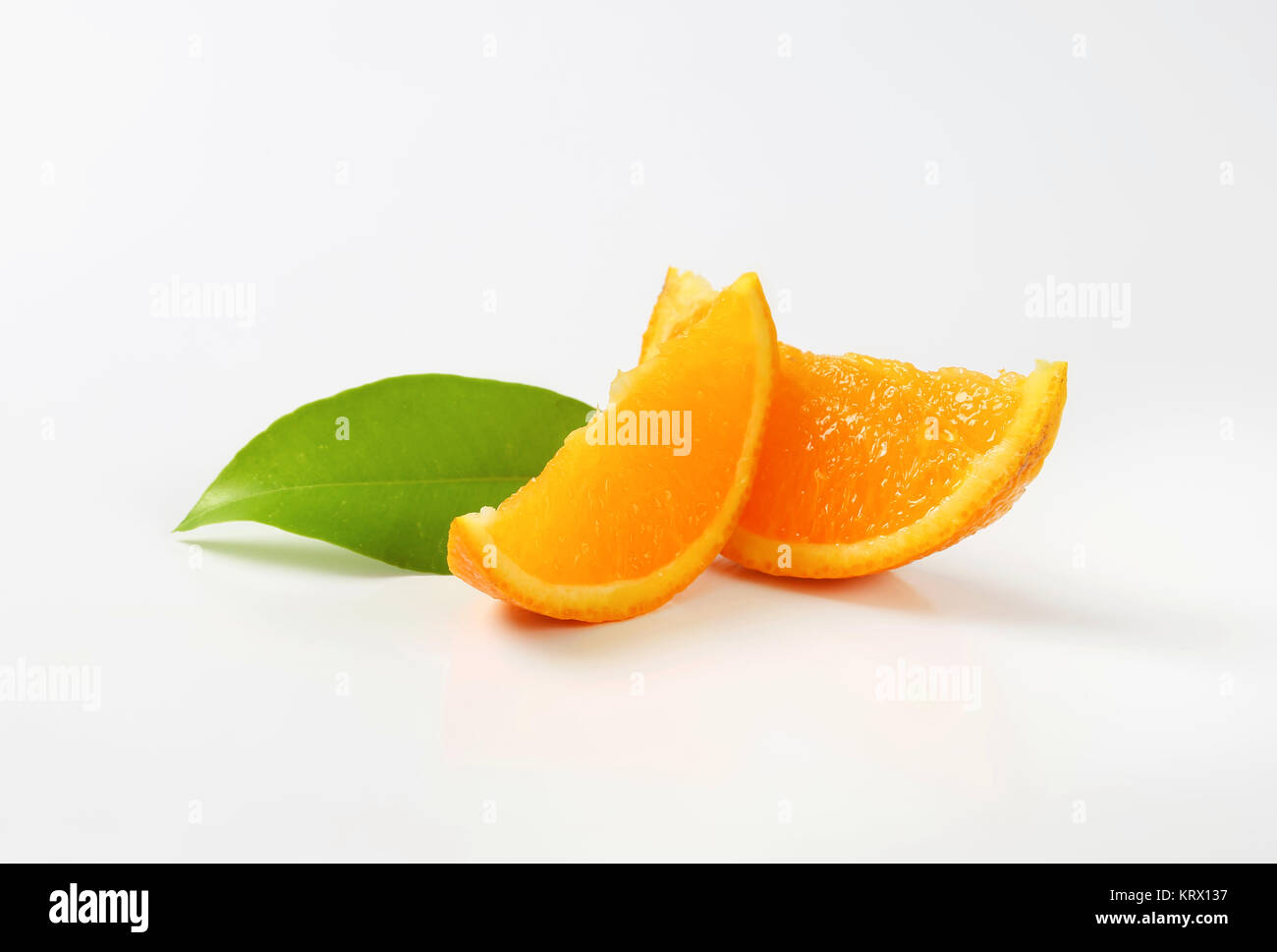 Fresh orange wedges Stock Photo - Alamy