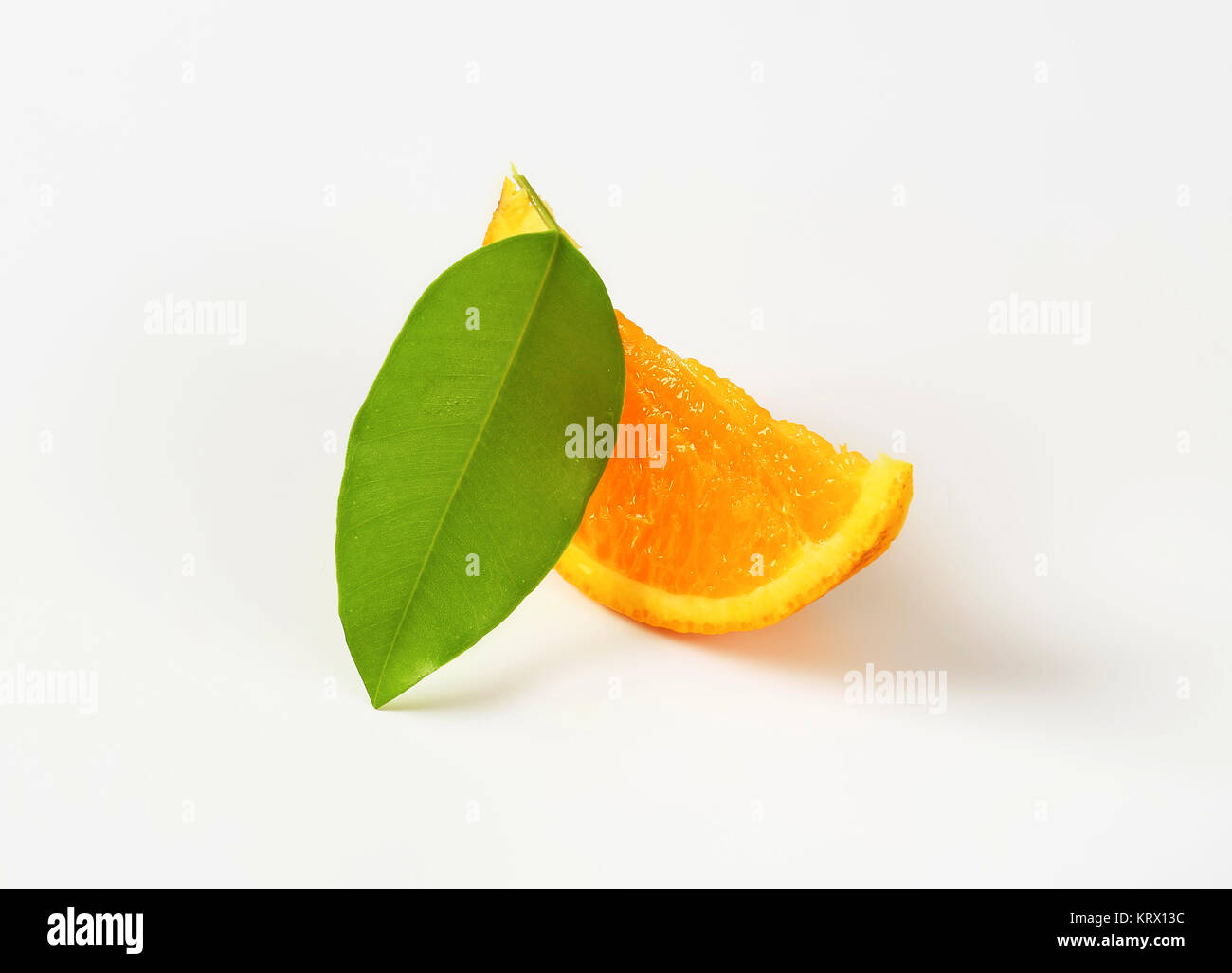Single orange wedge Stock Photo - Alamy
