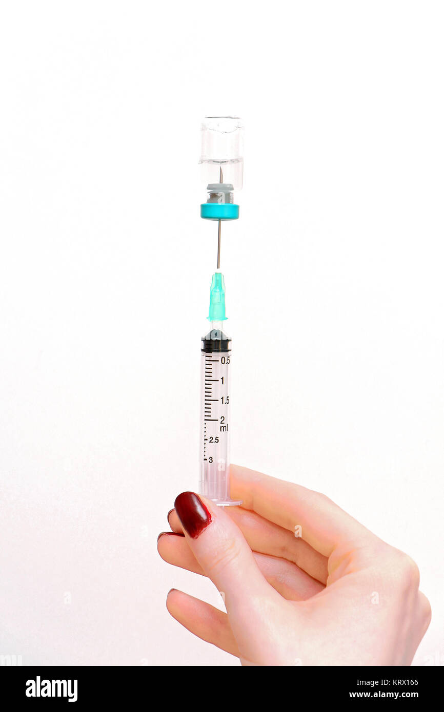 Syringe in hand Stock Photo - Alamy