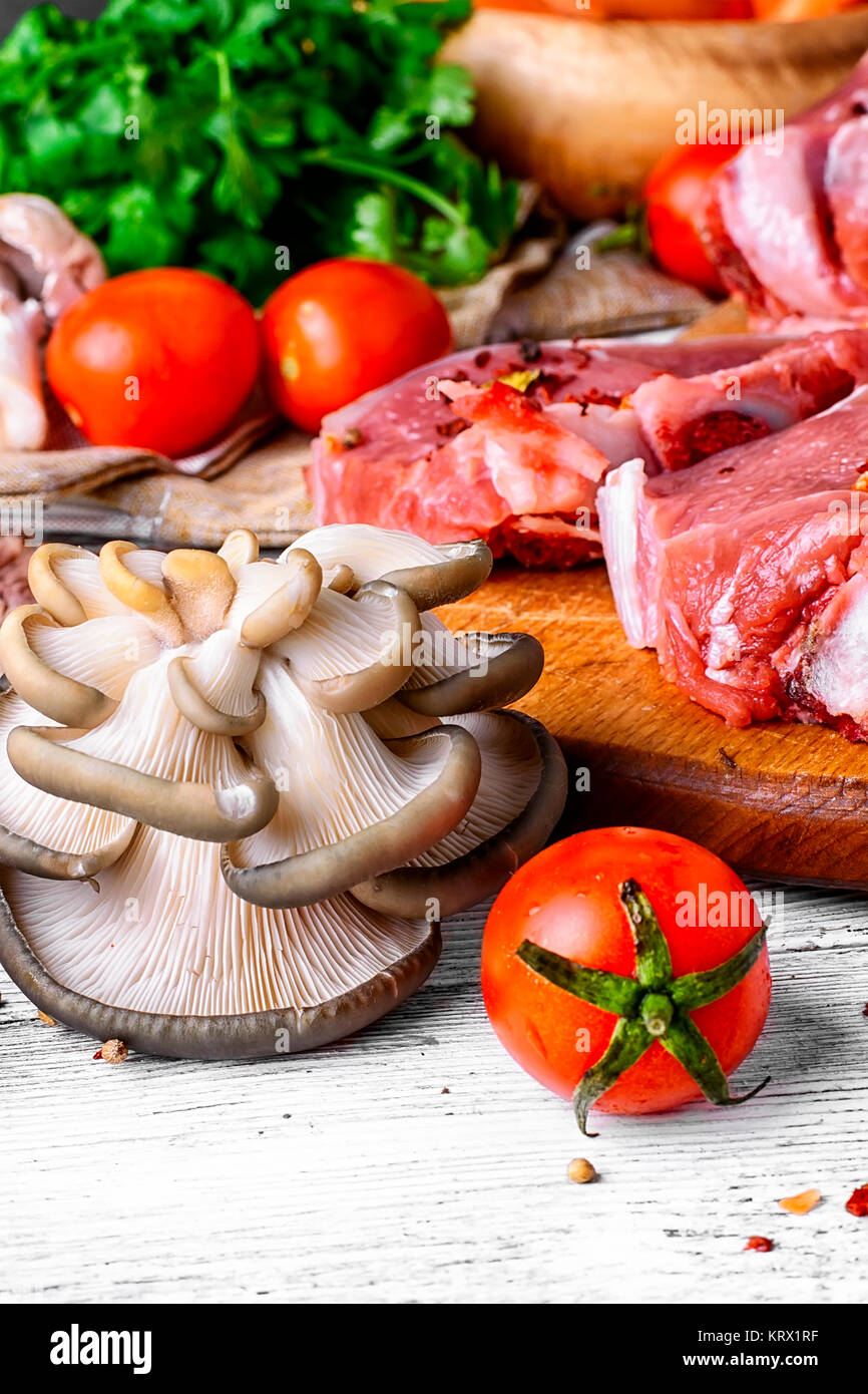 Raw meat on cutting board Stock Photo - Alamy