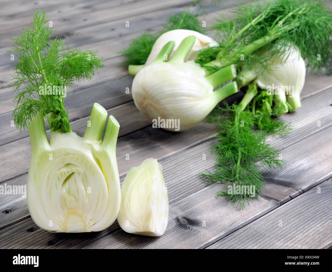Fresh fennel cut just harvested, photographed on wooden table Stock ...