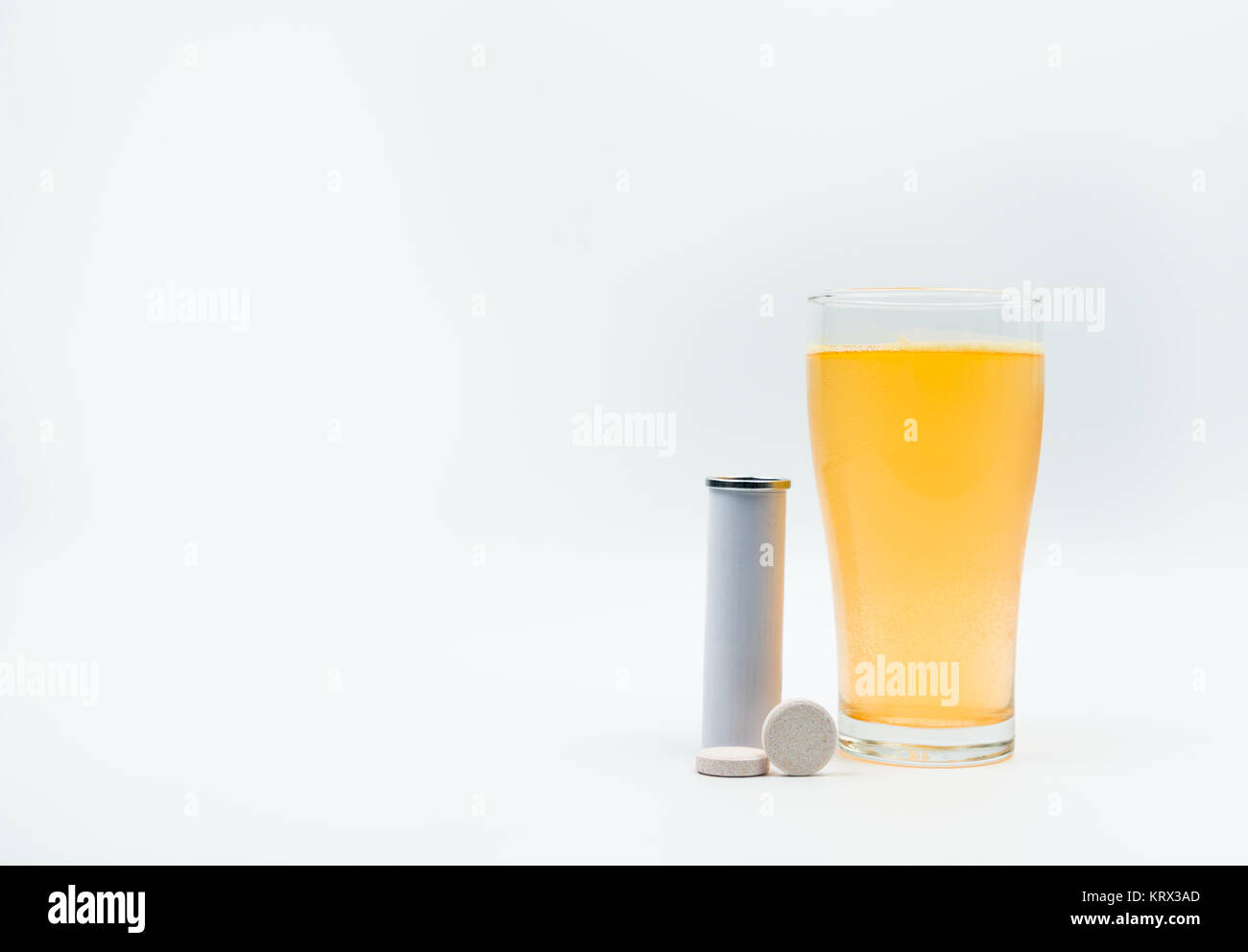 Effervescent tablets tube with blank label and orange effervescent ...