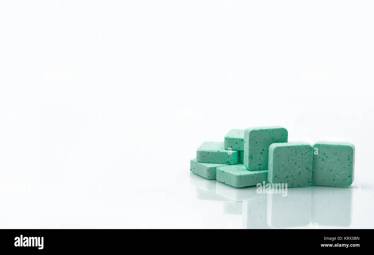 Macro shot to show detail of green medical lozenges for relief cough ...