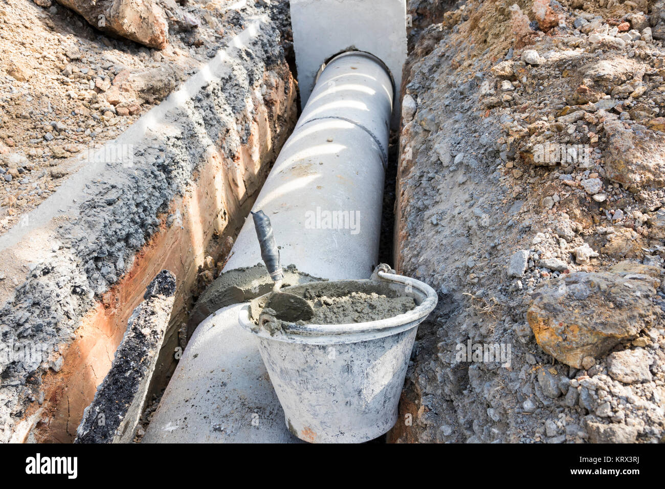 worker install concrete manholes construction; for draining storm water ...