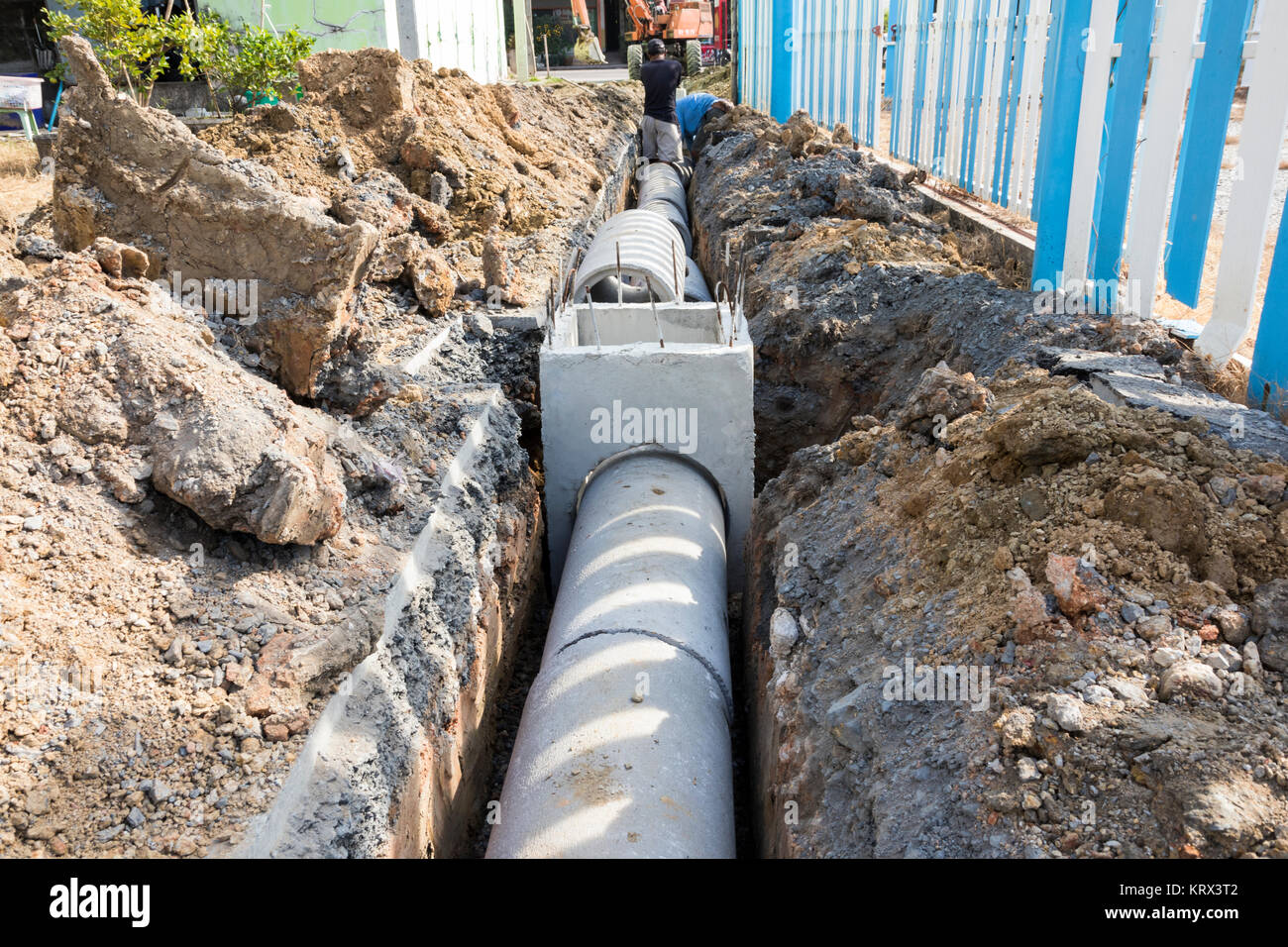 worker install concrete manholes construction; for draining storm water ...