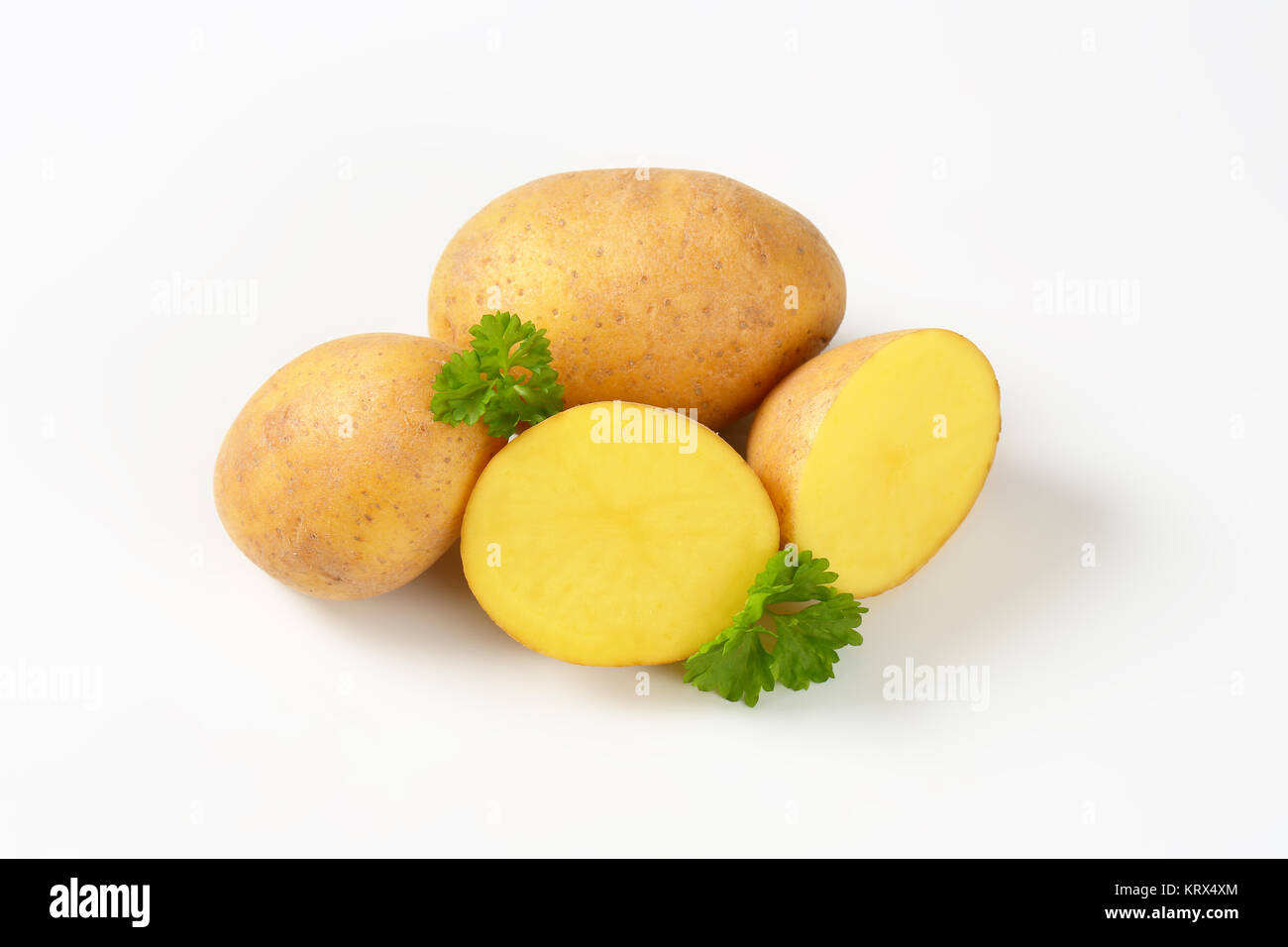 whole and halved potatoes Stock Photo - Alamy