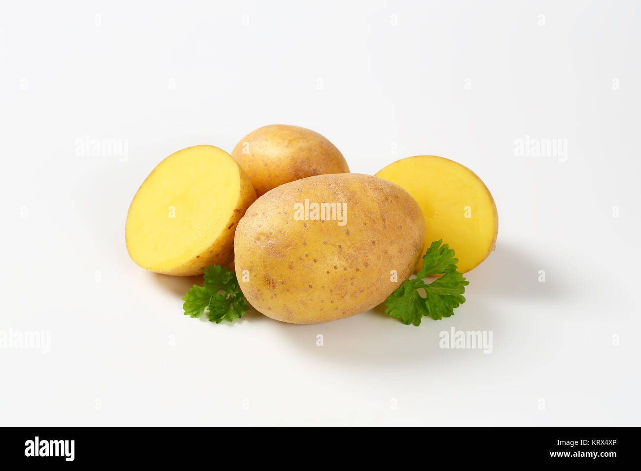 whole and halved potatoes Stock Photo - Alamy