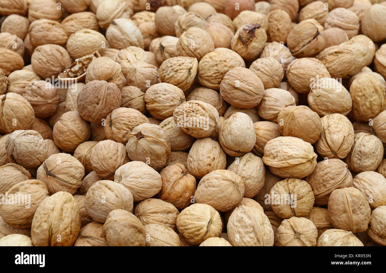 Whole walnuts in nutshells close up Stock Photo - Alamy