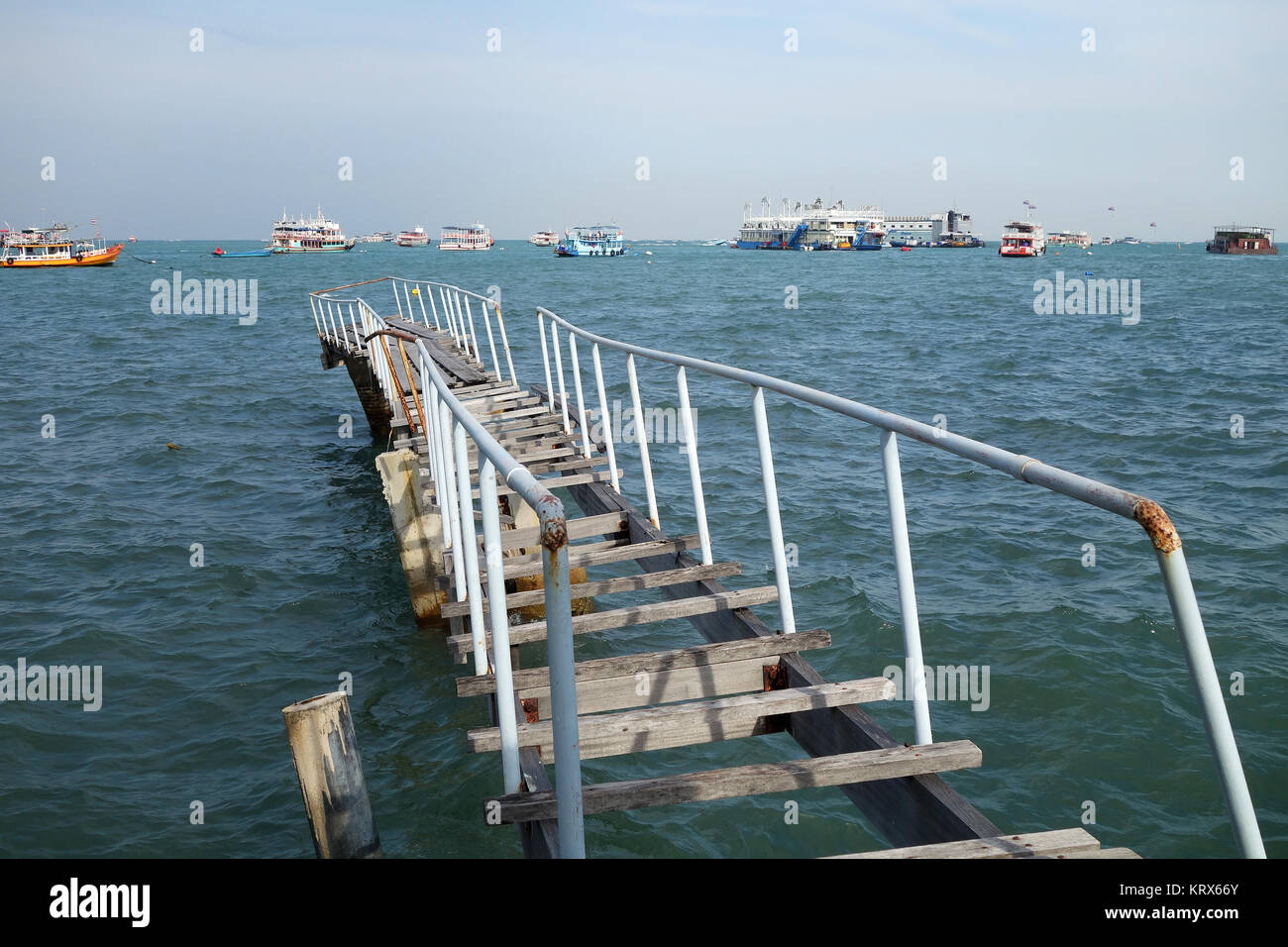 The wooden bridge extending into the sea Stock Photo - Alamy