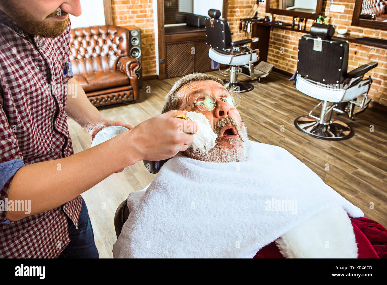 Santa claus shaving his personal barber Stock Photo - Alamy