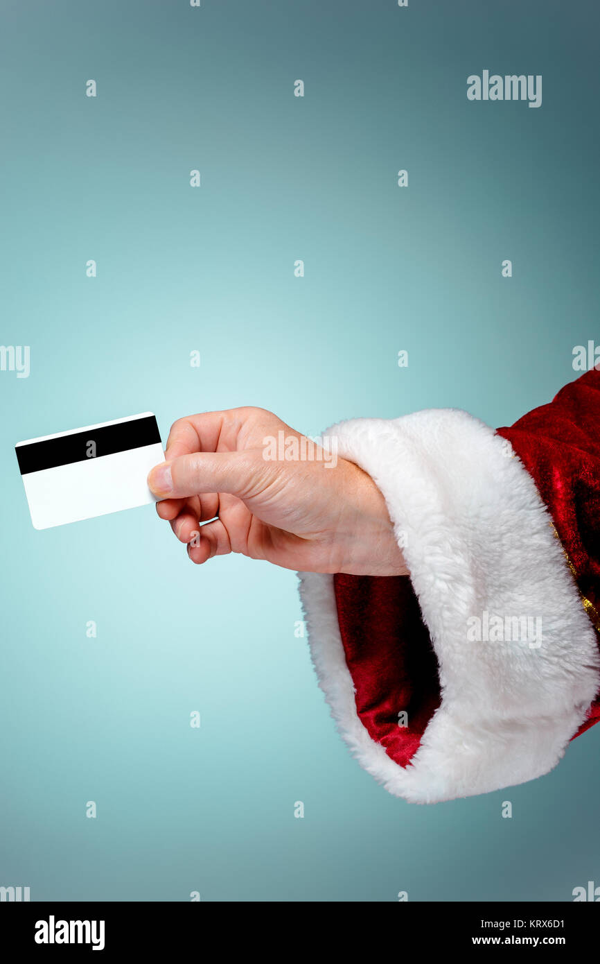 Santa Claus hand holding a credit card Stock Photo - Alamy