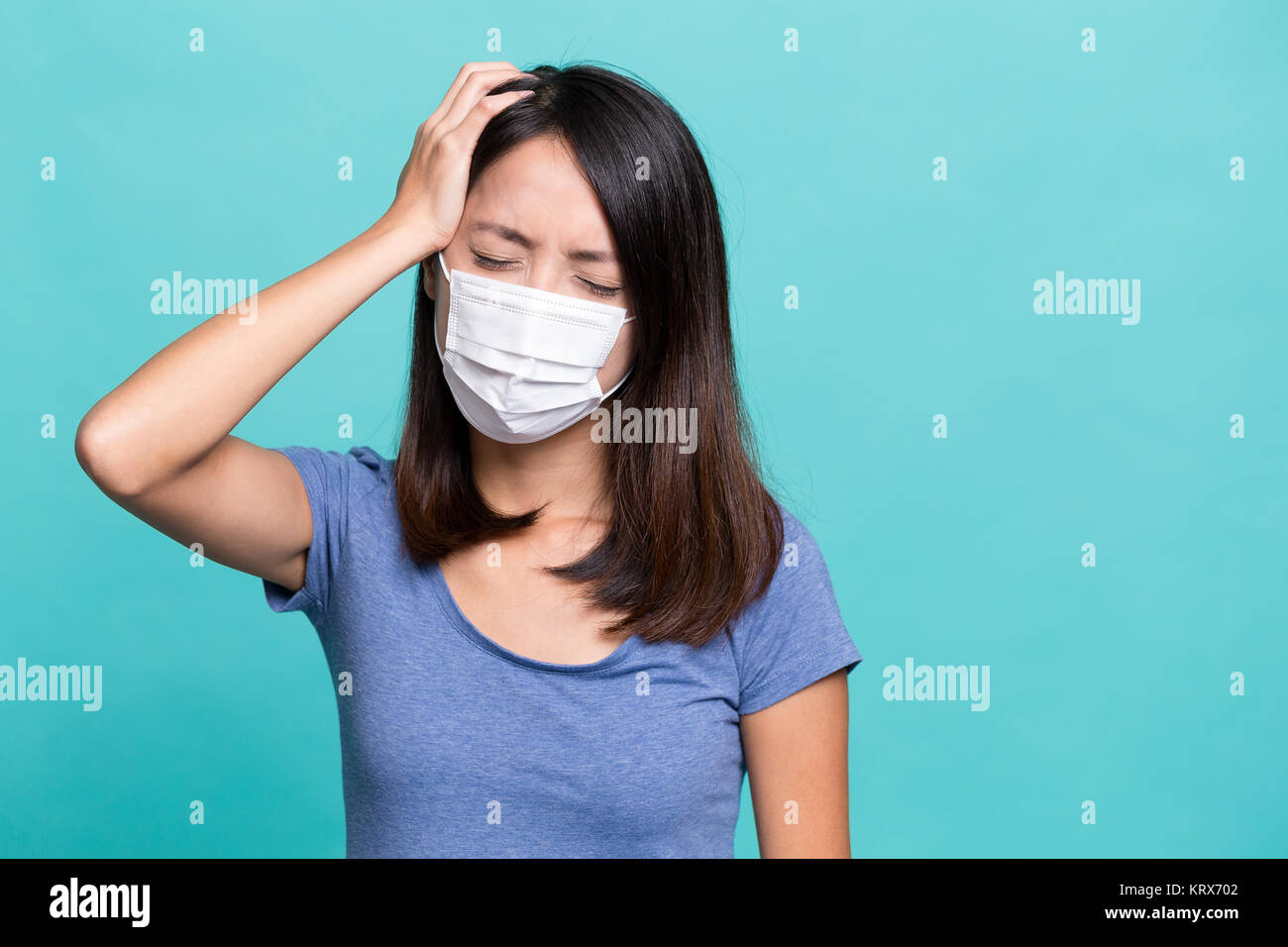 Young Woman feeling sick and wearing face mask Stock Photo - Alamy