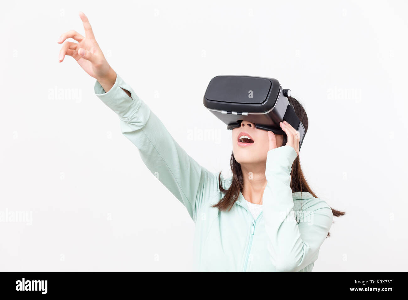 Woman experience using VR headset Stock Photo - Alamy