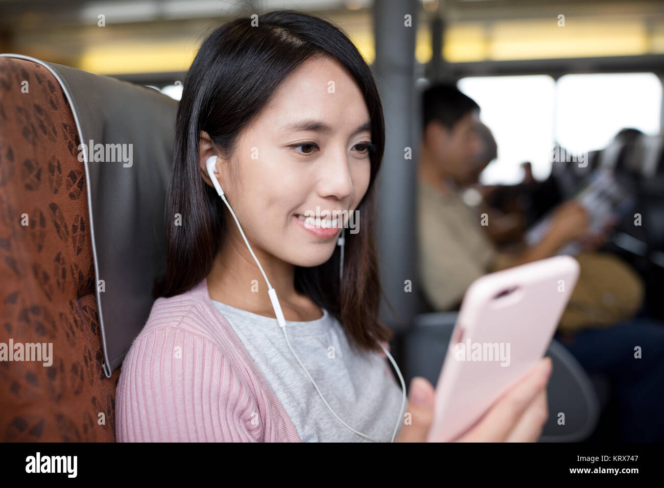 Woman listen to song on mobile phone Stock Photo - Alamy