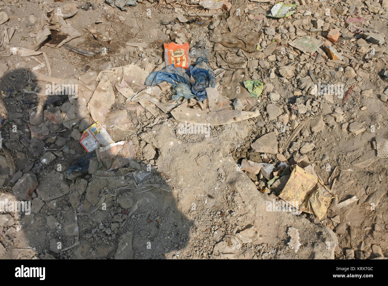 Just rubbish on the ground awaiting more dust to bury it Stock Photo ...
