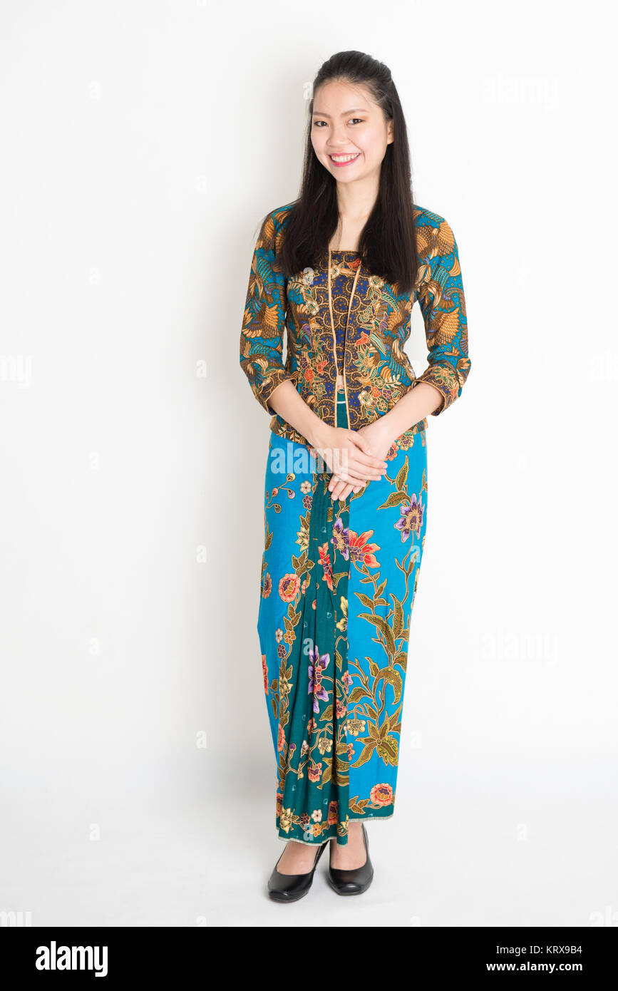 Southeast Asian girl in batik dress smiling Stock Photo - Alamy