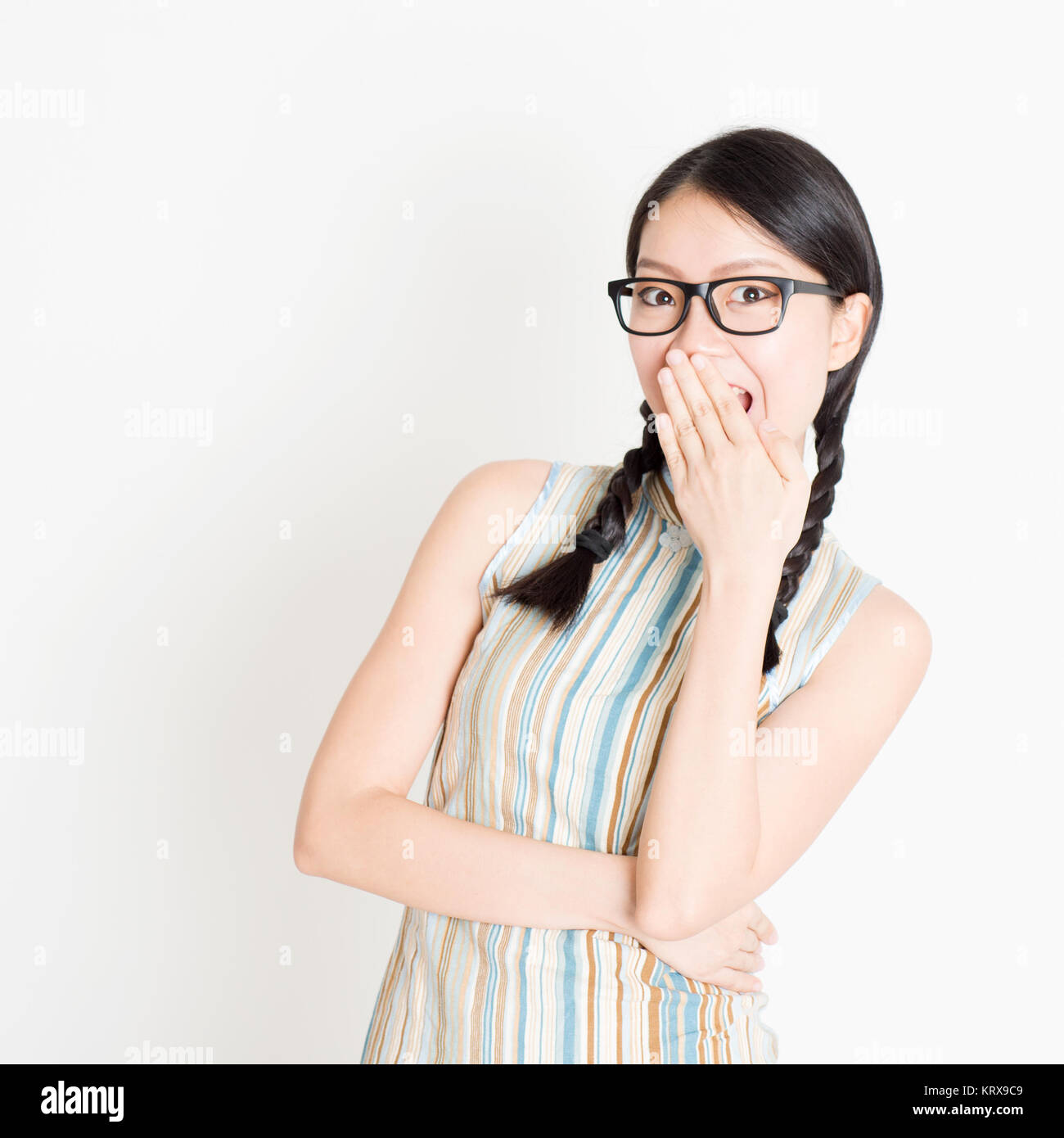 Asian woman laugh and covering mouth Stock Photo - Alamy
