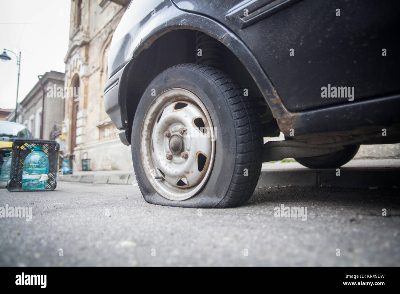 Car flat tire Stock Photo - Alamy