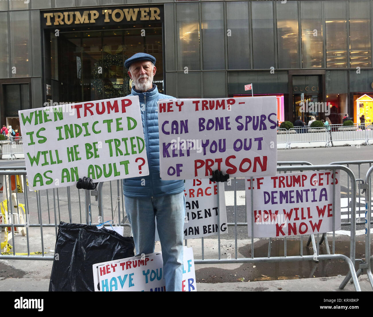 New York City, New York, USA. 20th Dec, 2017. An old man holds anti ...
