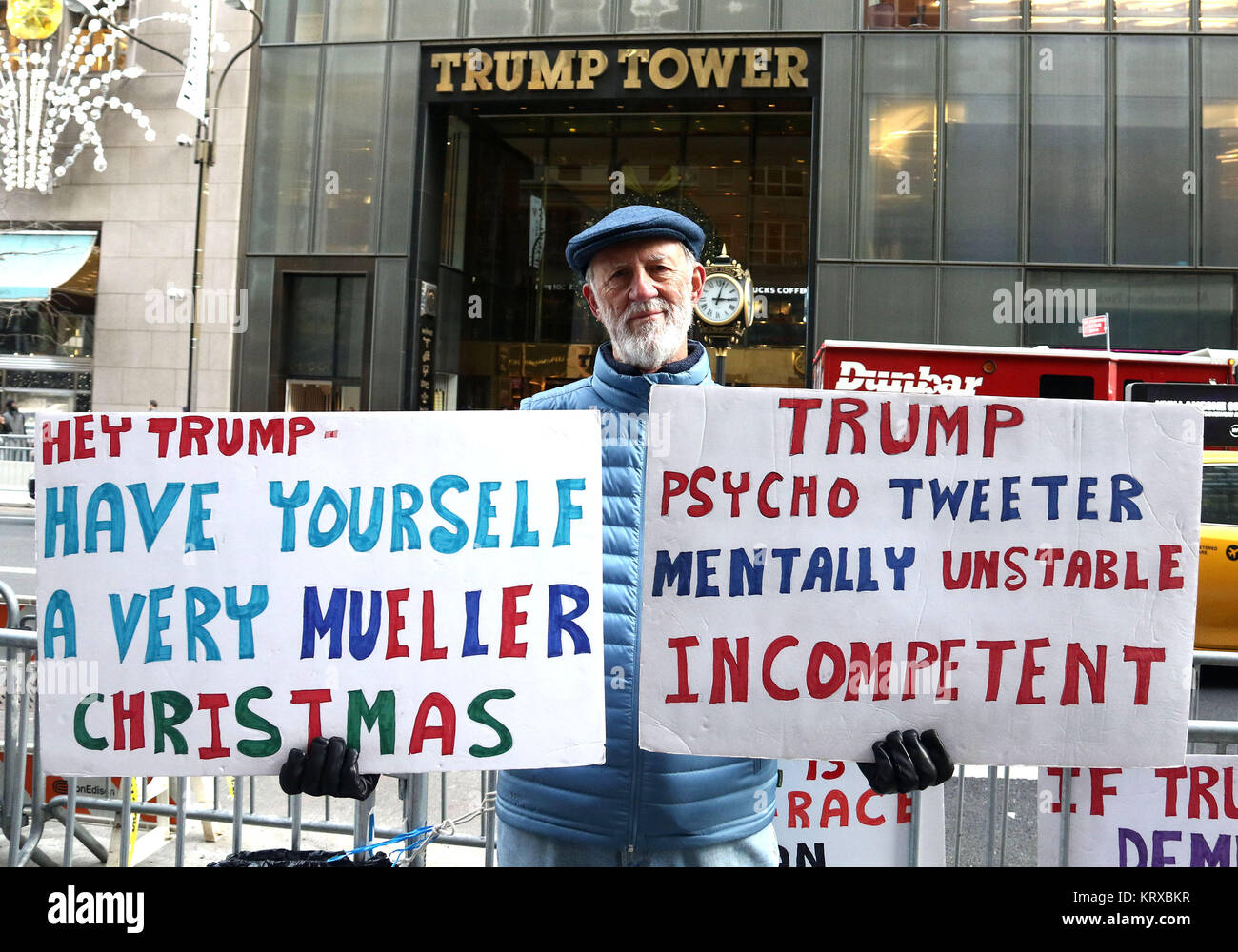 New York City, New York, USA. 20th Dec, 2017. An old man holds anti ...