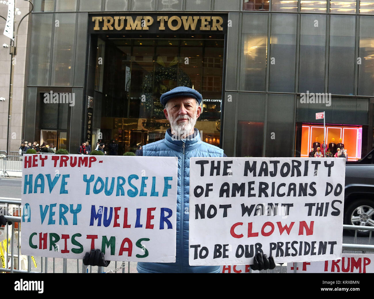 New York City, New York, USA. 20th Dec, 2017. An old man holds anti ...
