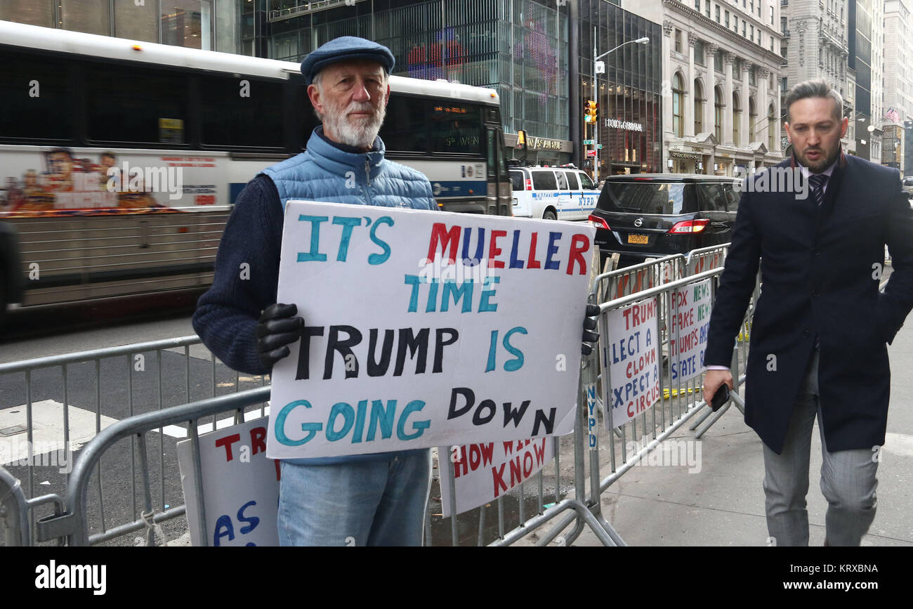 New York City, New York, USA. 20th Dec, 2017. An old man holds an anti ...