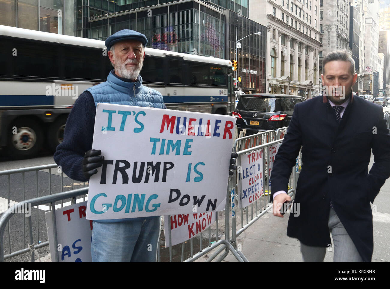 New York City, New York, USA. 20th Dec, 2017. An old man holds an anti ...