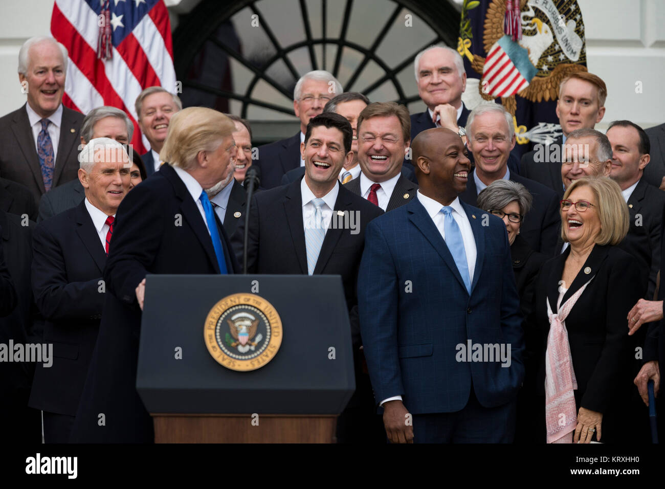 United States President Donald J. Trump turns to a laughing group of ...