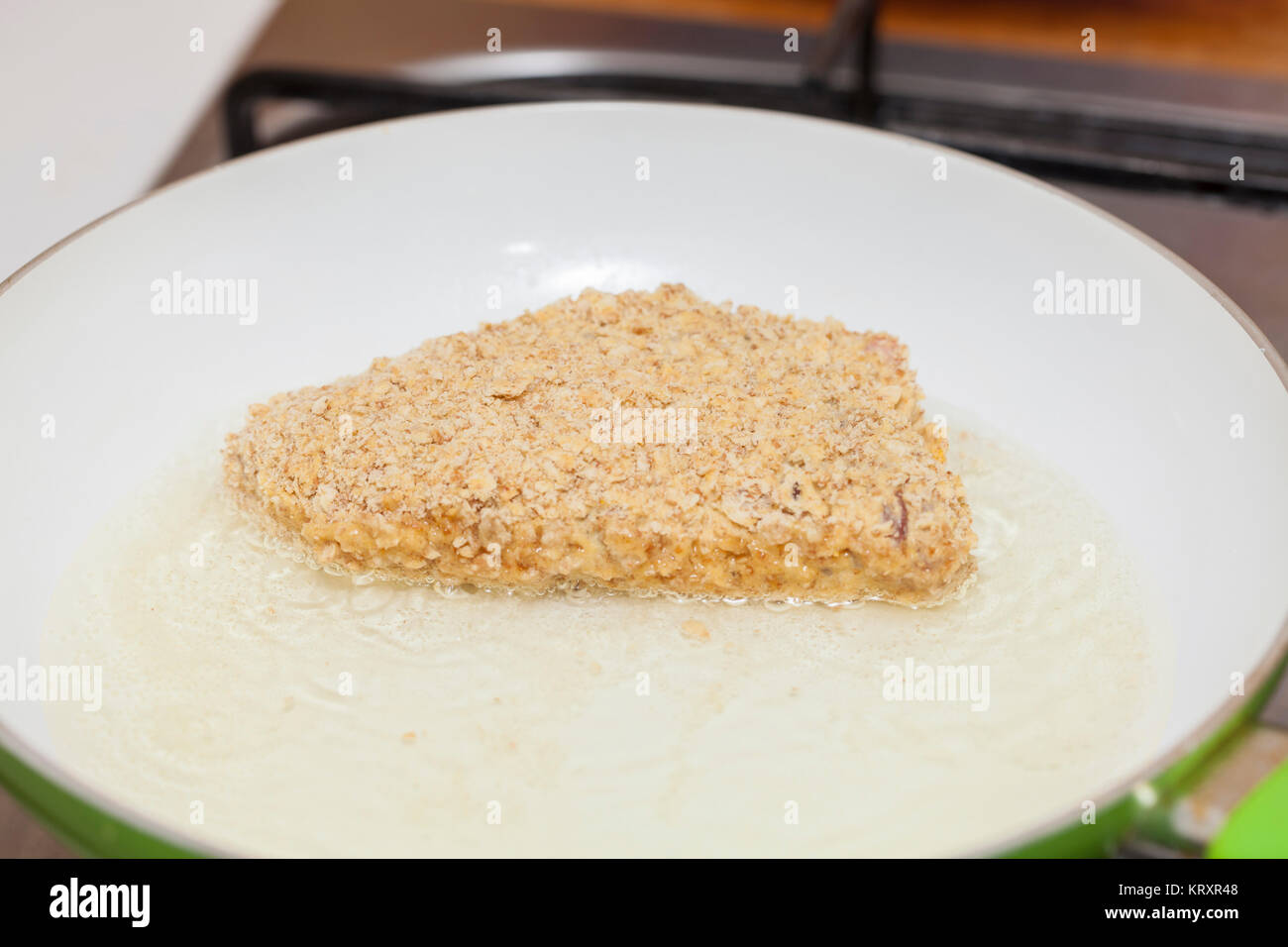 Cordon bleu preparation : Frying a cordon bleu Stock Photo - Alamy