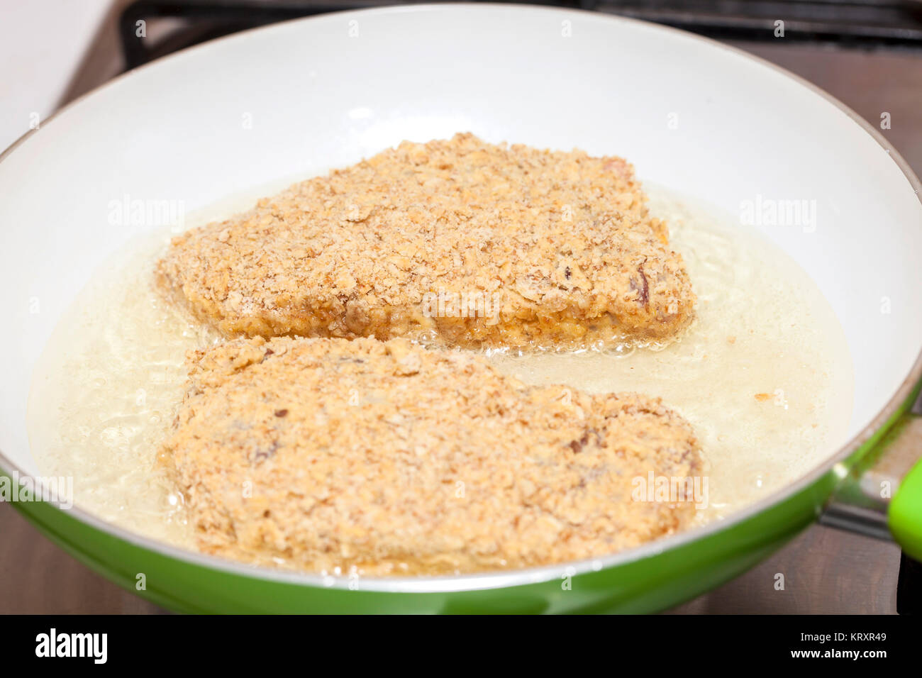 Cordon bleu preparation : Frying a cordon bleu Stock Photo - Alamy