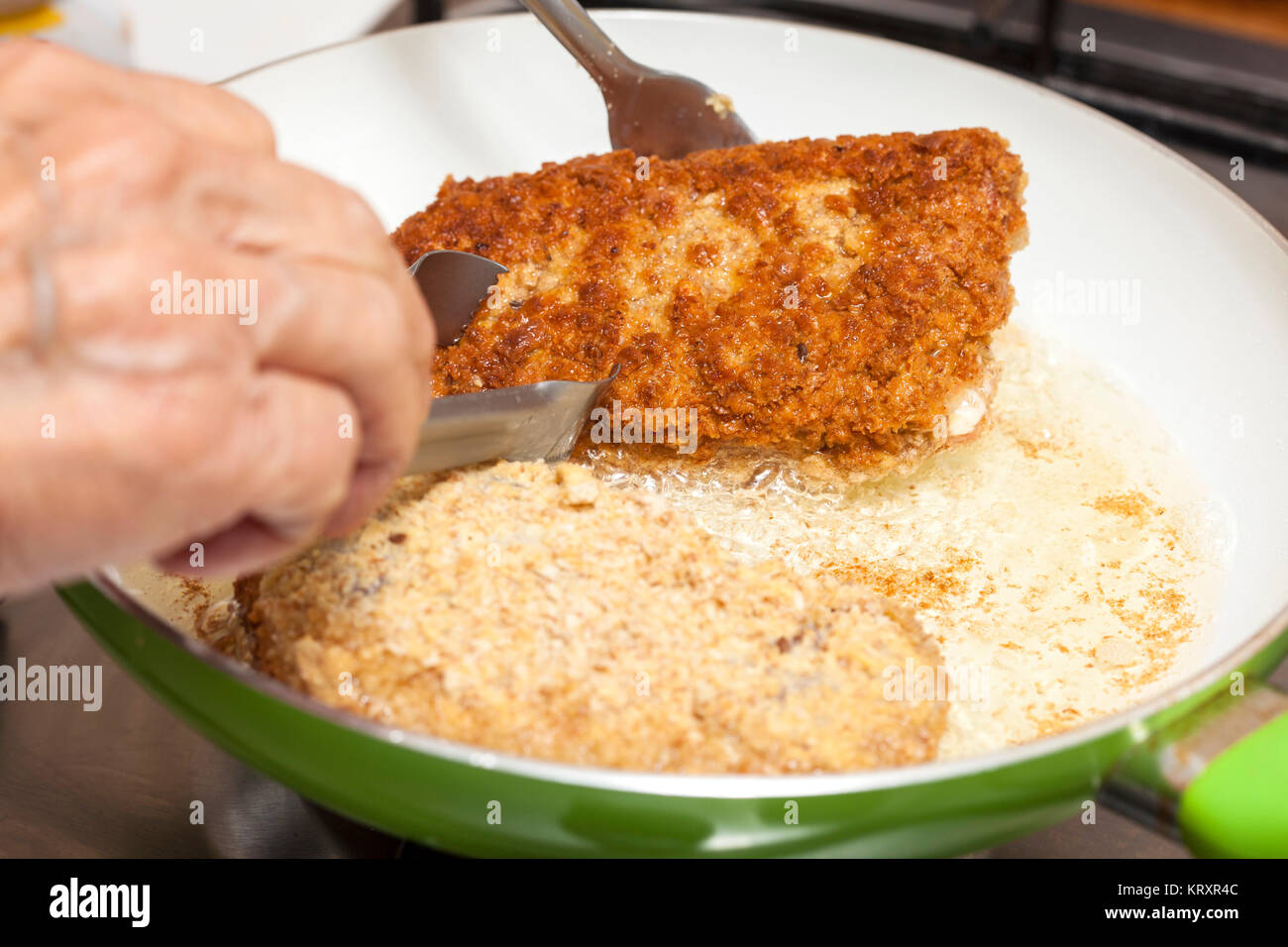 Cordon bleu preparation : Frying a cordon bleu Stock Photo - Alamy