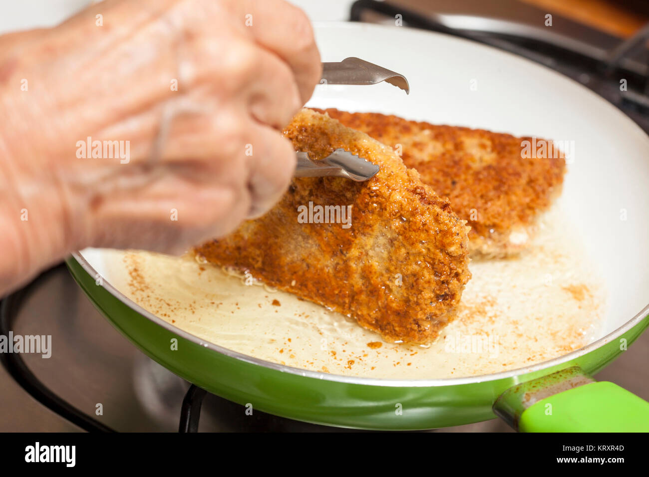 Cordon bleu preparation : Frying a cordon bleu Stock Photo - Alamy